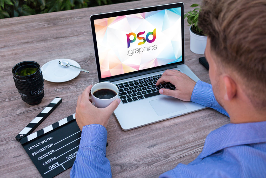 Man Working on Macbook Mockup PSD | PSD Graphics